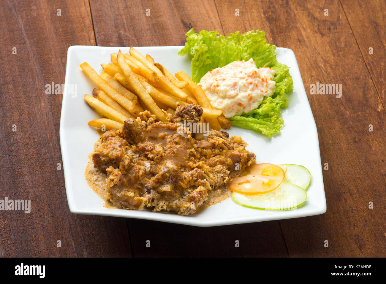 asian chicken chop with fries Stock Photo - Alamy