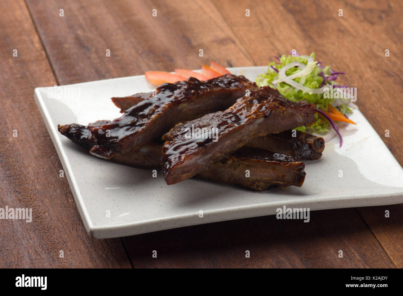 Roasted sliced barbecue pork ribs, focus on sliced meat Stock Photo - Alamy
