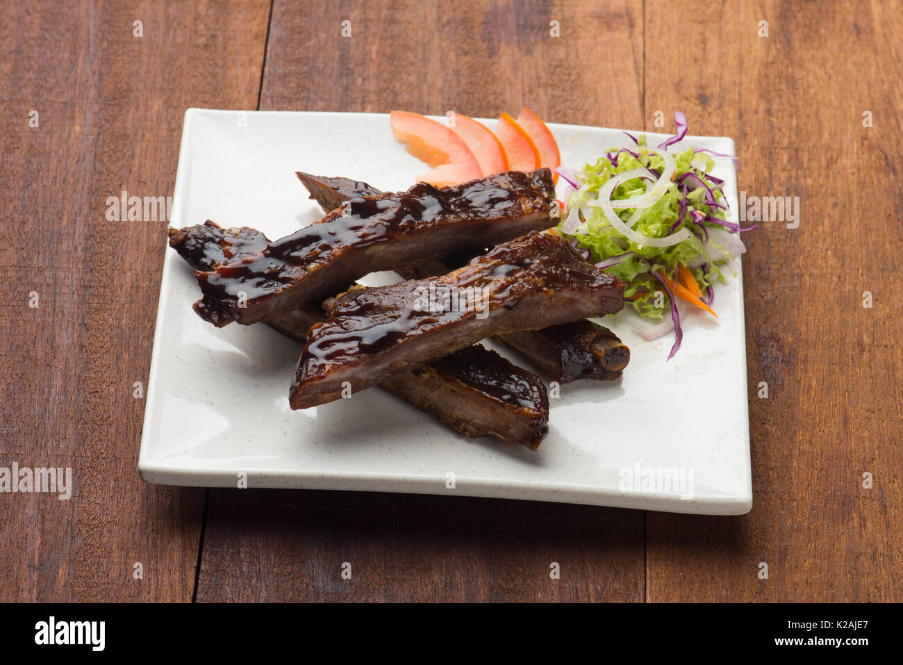 Roasted sliced barbecue pork ribs, focus on sliced meat Stock Photo - Alamy