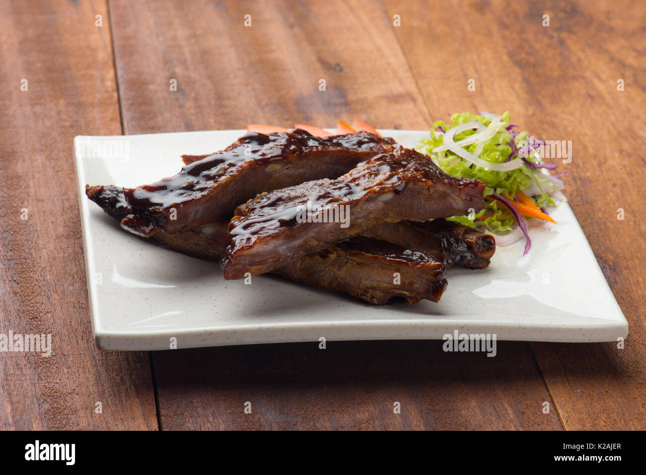 Roasted sliced barbecue pork ribs, focus on sliced meat Stock Photo - Alamy