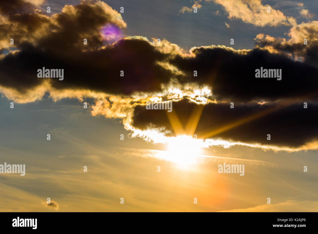 Dramatic sunset sky with clouds and sun rays Stock Photo - Alamy