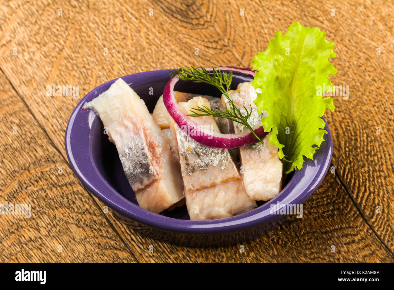 Sliced Herring fillet with dill and onion Stock Photo - Alamy