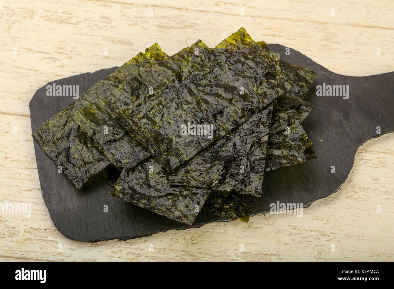 Crispy Nori sheets chips over wooden background Stock Photo - Alamy
