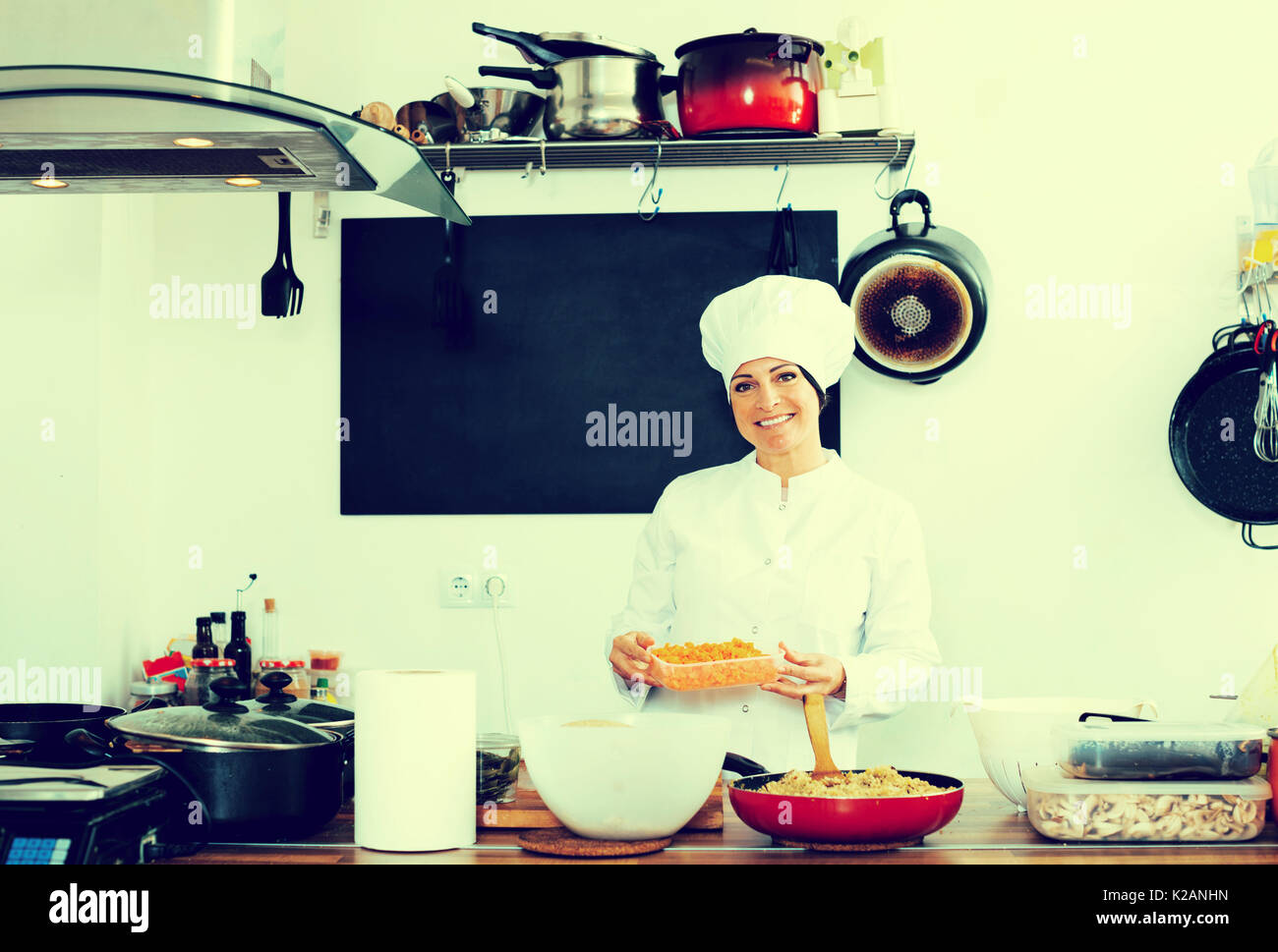 Mature woman cooking spices hi-res stock photography and images - Alamy