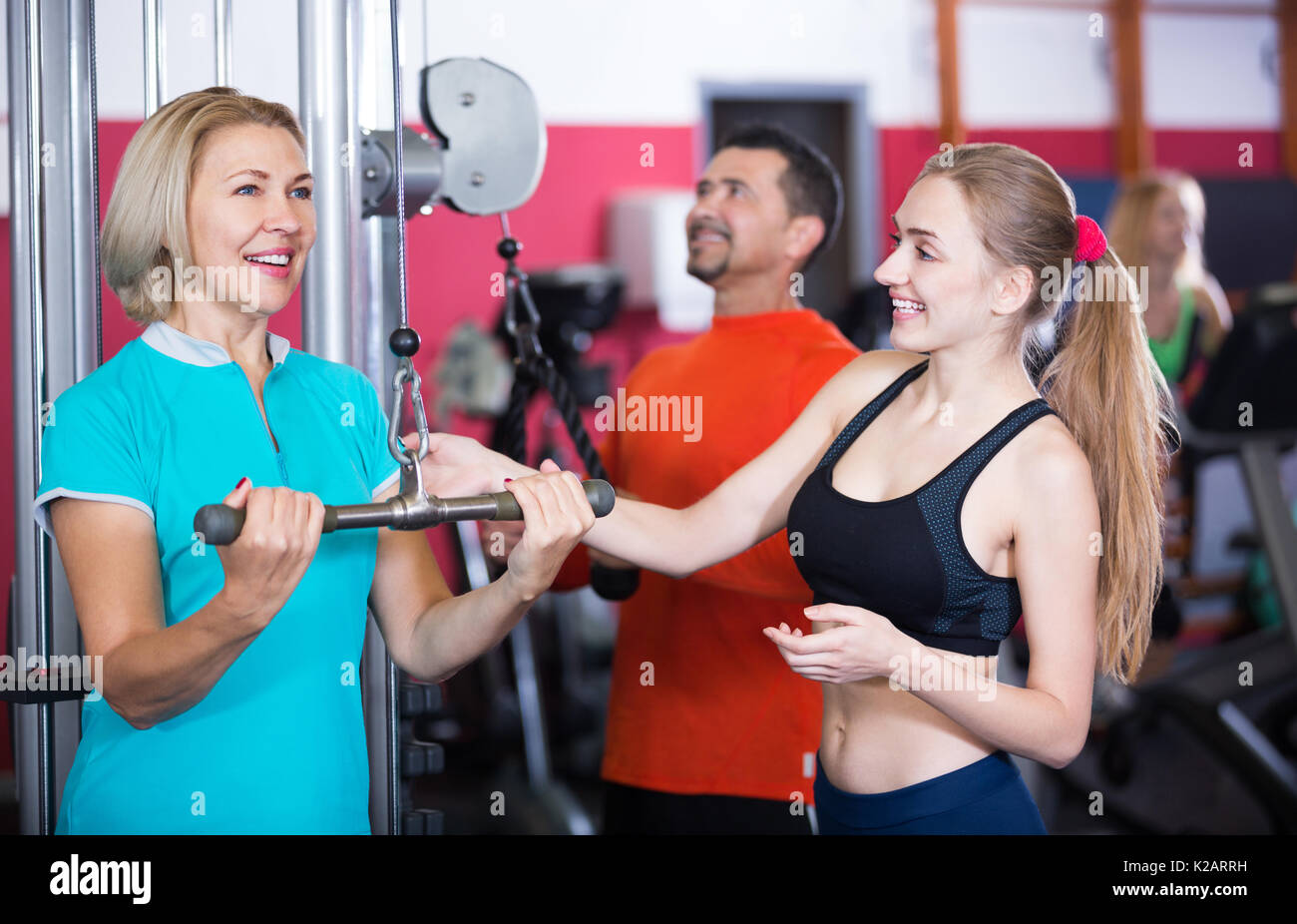 Adults of different age training in gym-hall Stock Photo - Alamy
