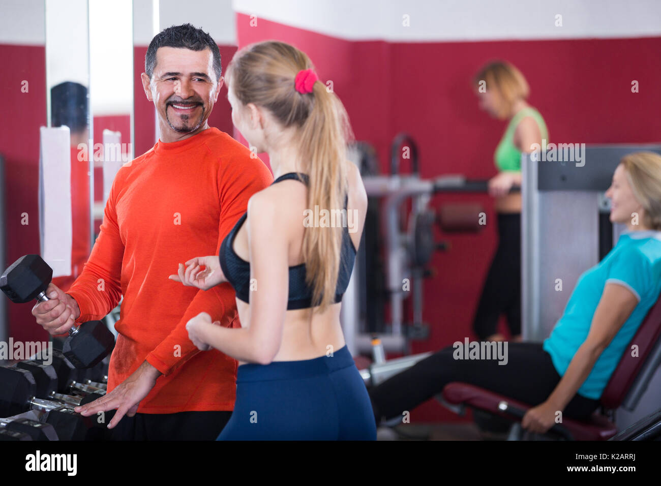 Group adults of different age having strength training in gym Stock ...