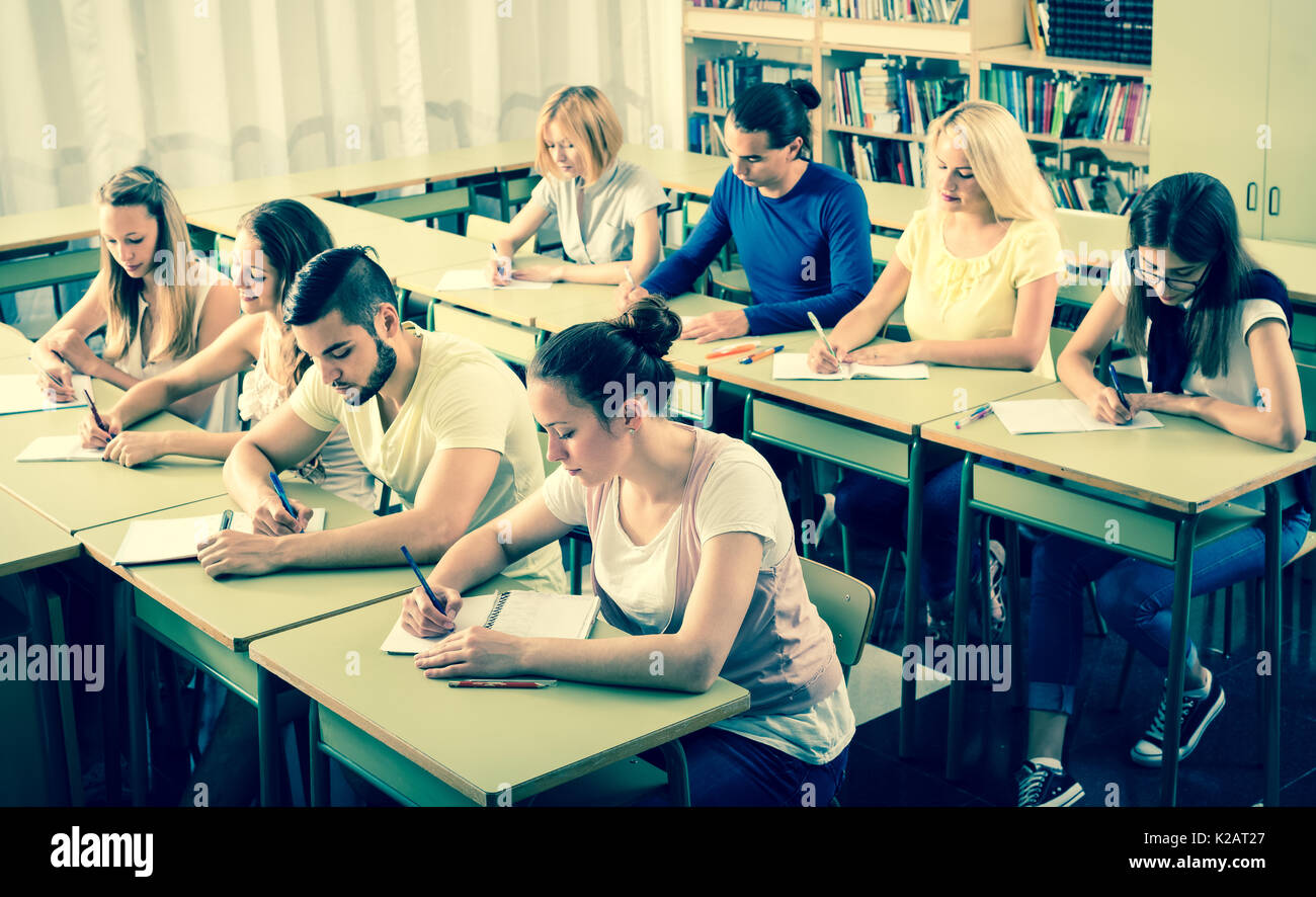 Adult highschool students learning in classroom at their desks Stock ...