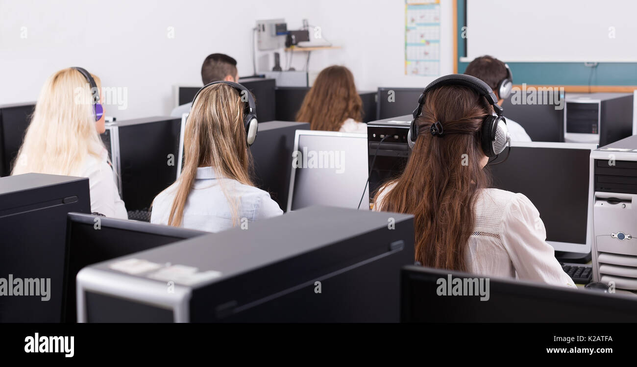 Employees of technical support line receiving calls inside Stock Photo ...