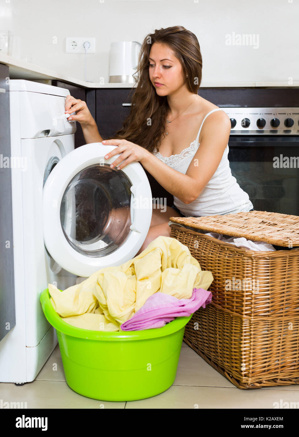 Home laundry sad girl clothes hi-res stock photography and images - Alamy