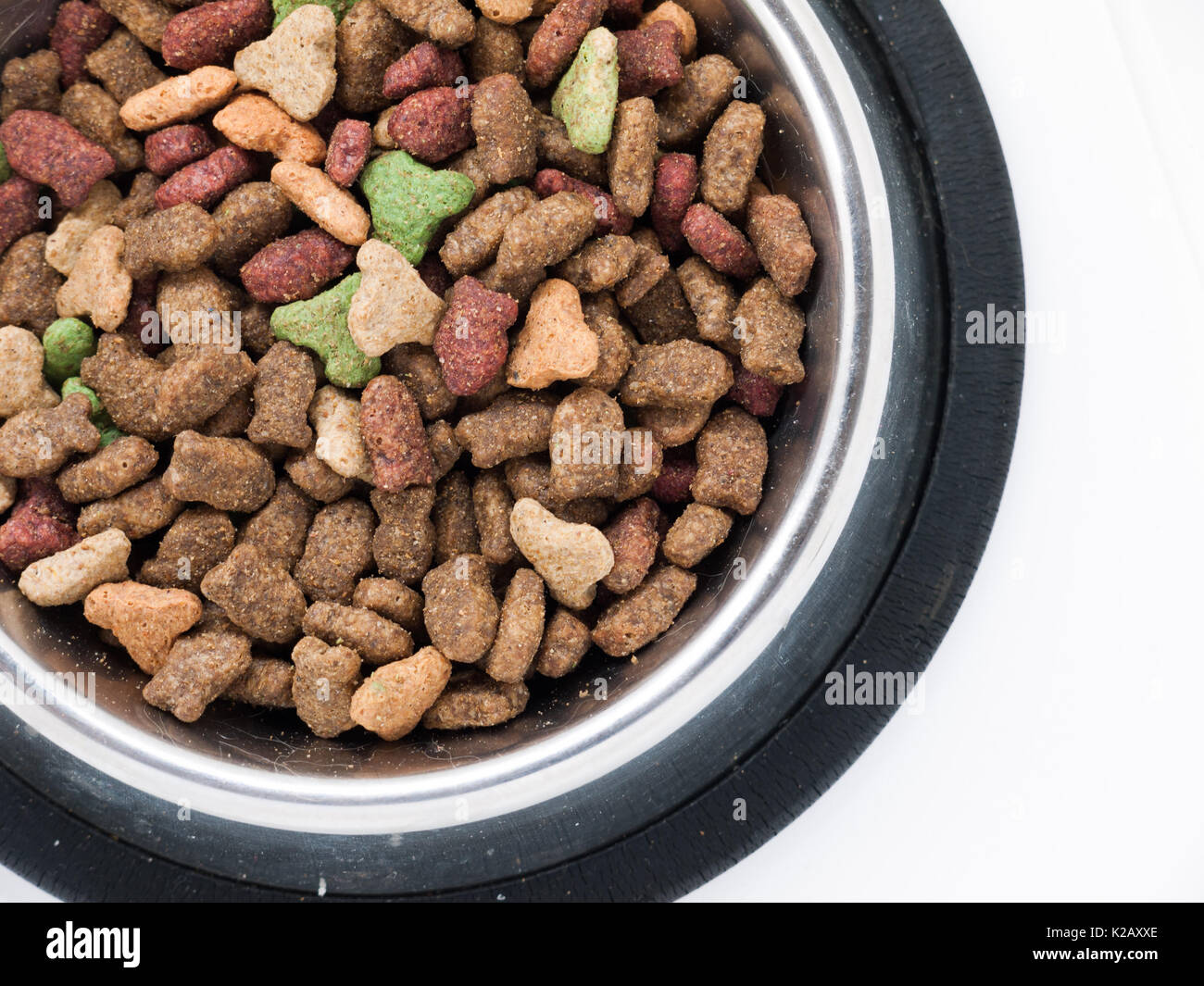 Closeup image of a bowl of cat biscuits on a white background Stock ...