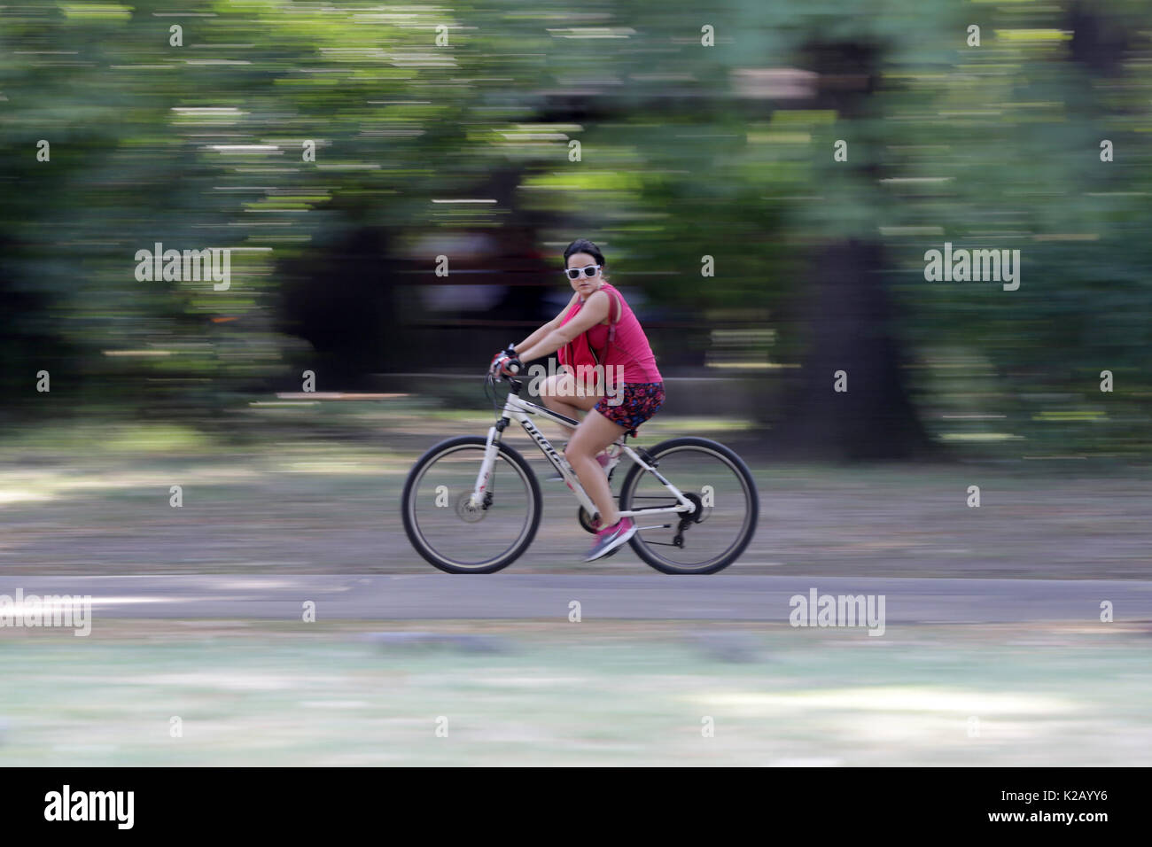 Woman rides bike on nature hi-res stock photography and images - Alamy