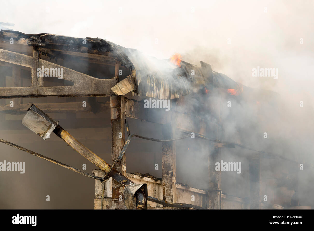 Fire disaster in a warehouse. Fire fighting in an industrial area Stock ...