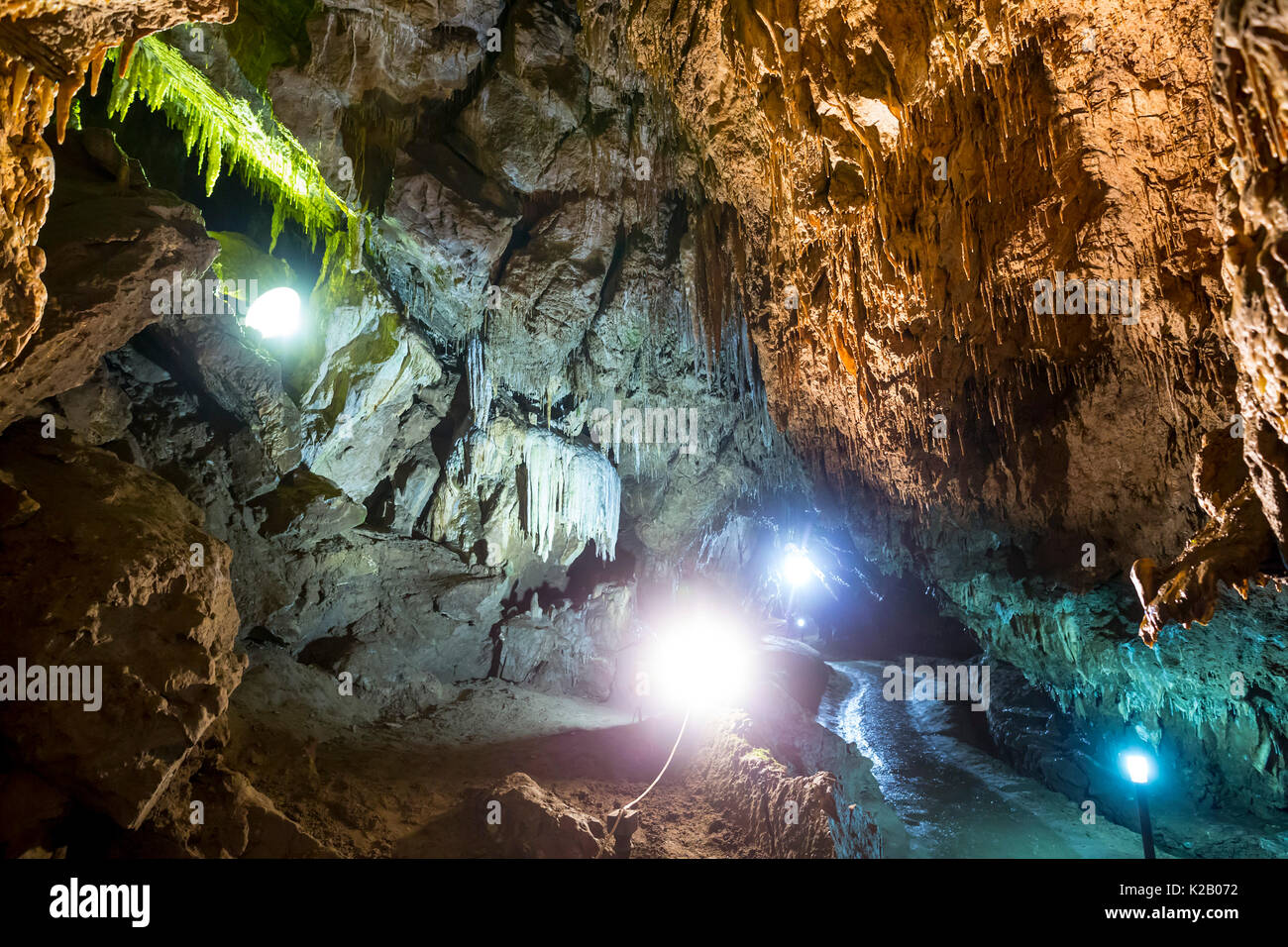 Inside of a beautiful colourful cave. Flowstones, stalactites and ...