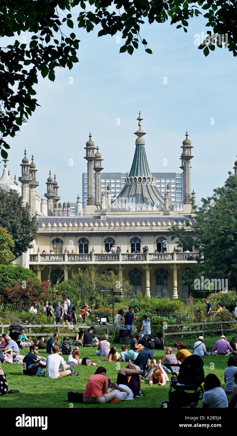 The Royal Pavilion and Gardens busy on a warm summers day in Brighton ...