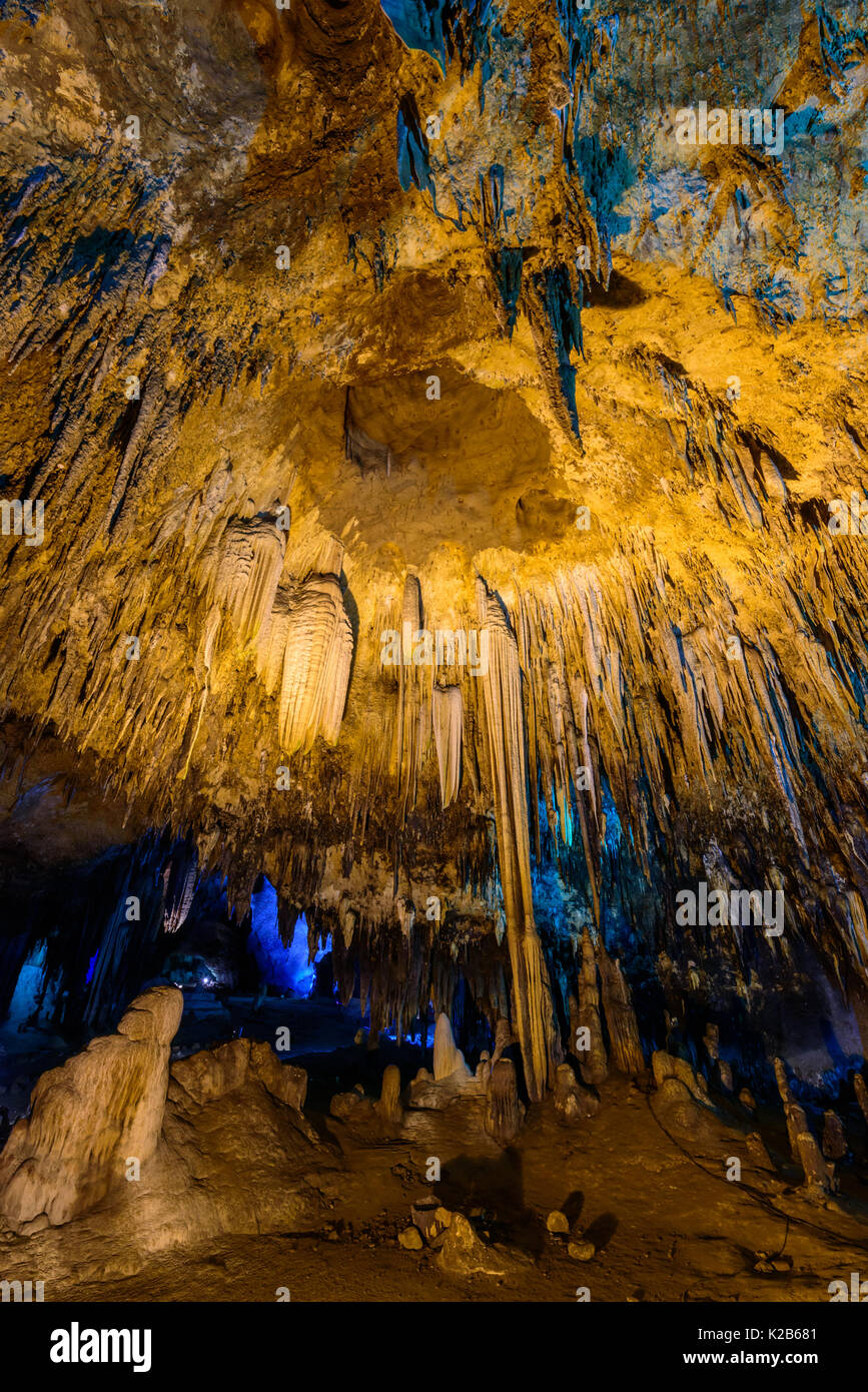 Stalactite stalactites with color lighting in cave Stock Photo - Alamy