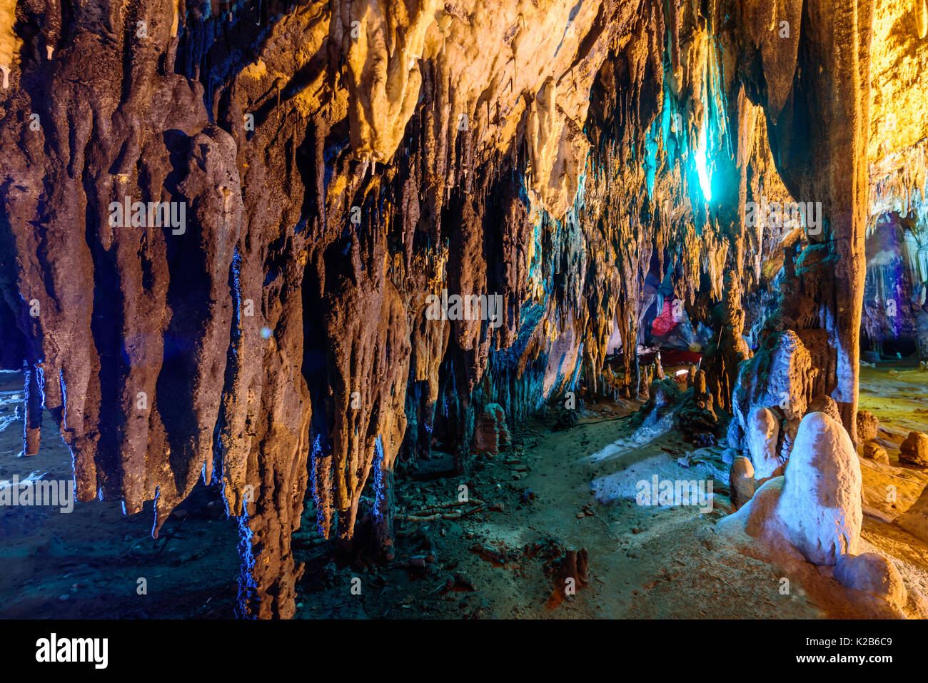 Stalactite stalactites with color lighting in cave Stock Photo - Alamy