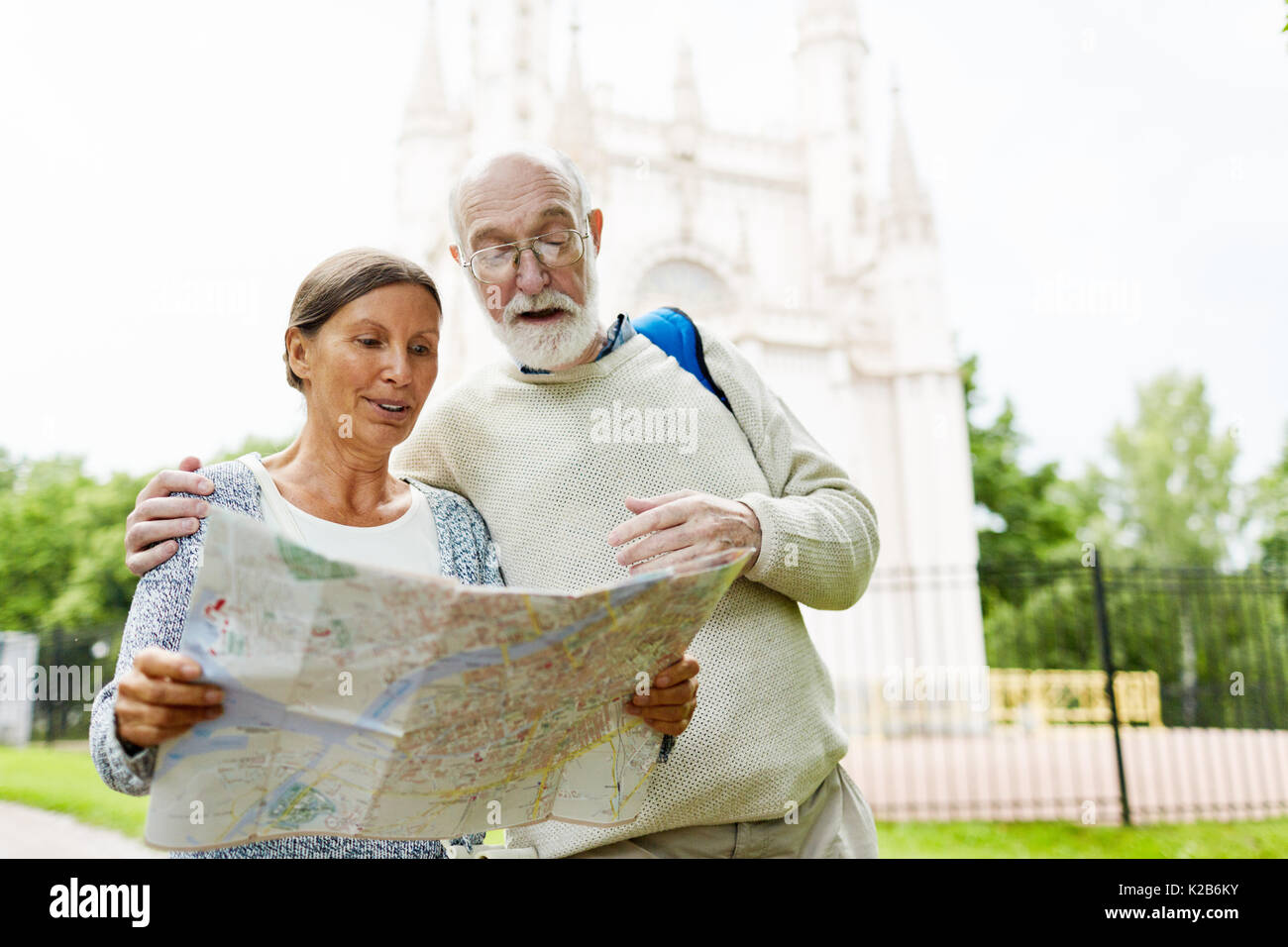 Seniors with map Stock Photo - Alamy