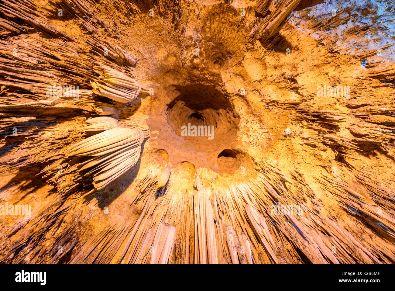 Stalactite stalactites with color lighting in cave Stock Photo - Alamy