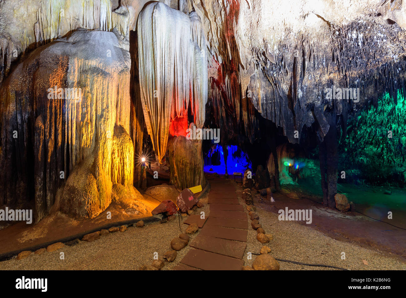 Stalactite stalactites with color lighting in cave Stock Photo - Alamy