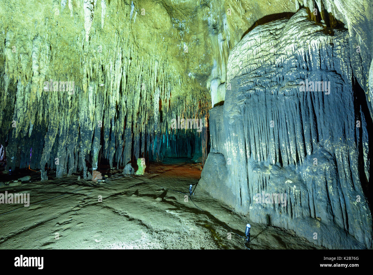 Stalactite stalactites with color lighting in cave Stock Photo - Alamy