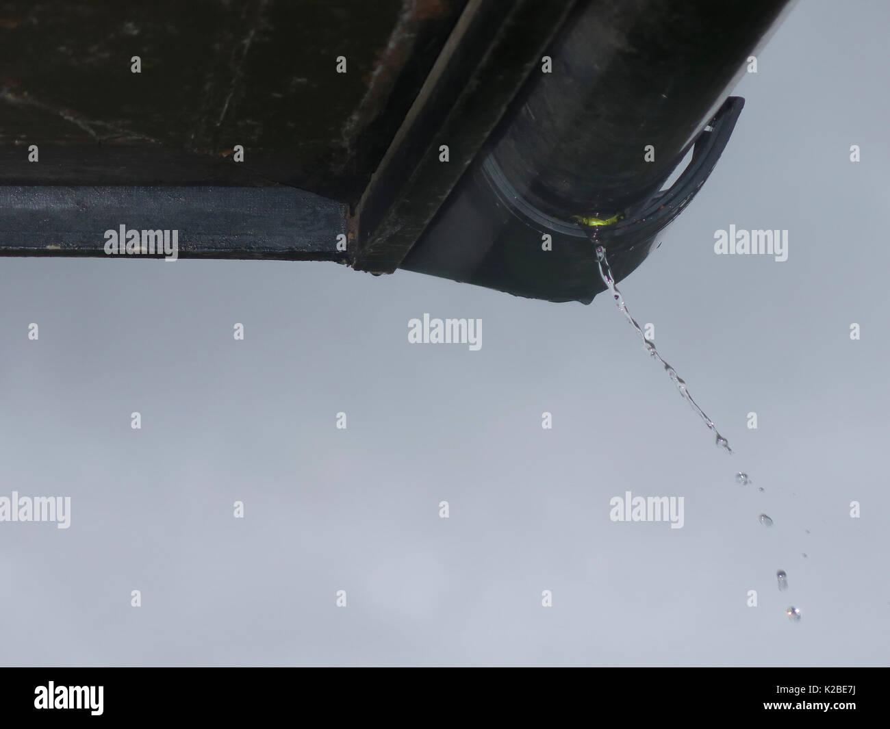 Rain overflowing from gutter Stock Photo - Alamy