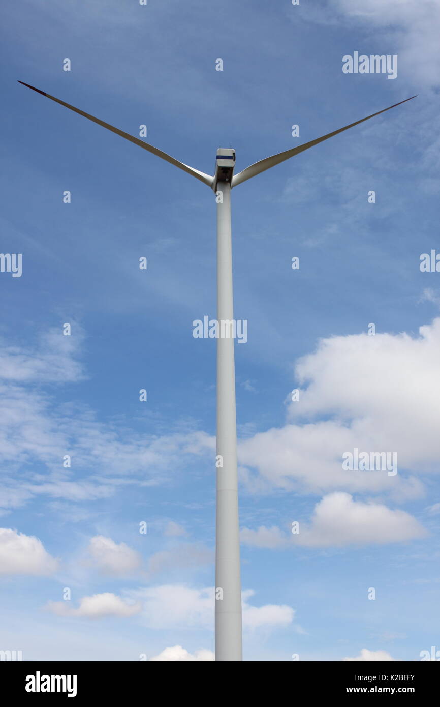 Wind mill against a blue sky and clouds Stock Photo - Alamy