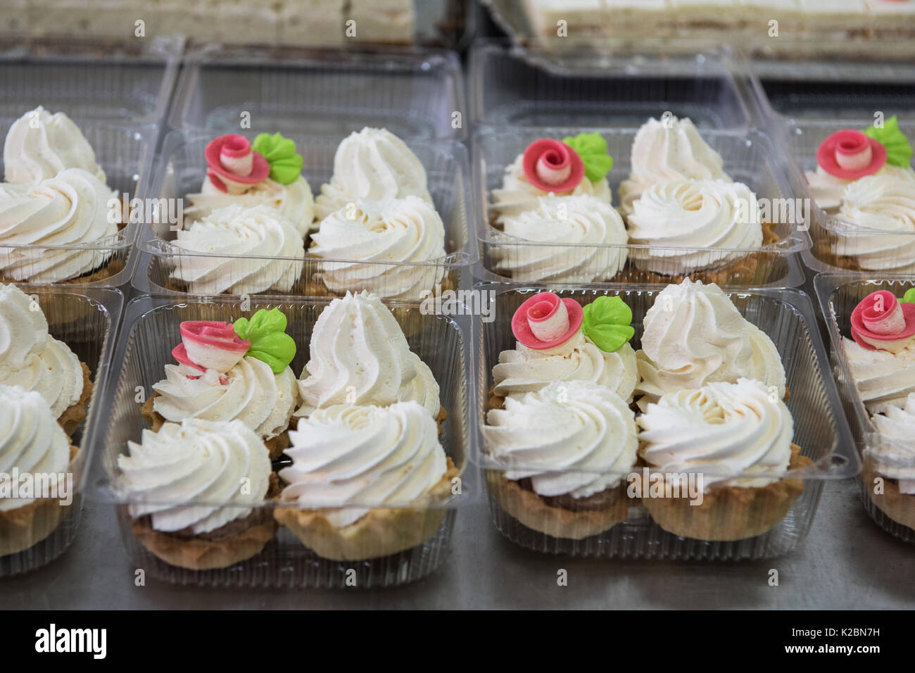 Ready mini cakes on factory Stock Photo - Alamy