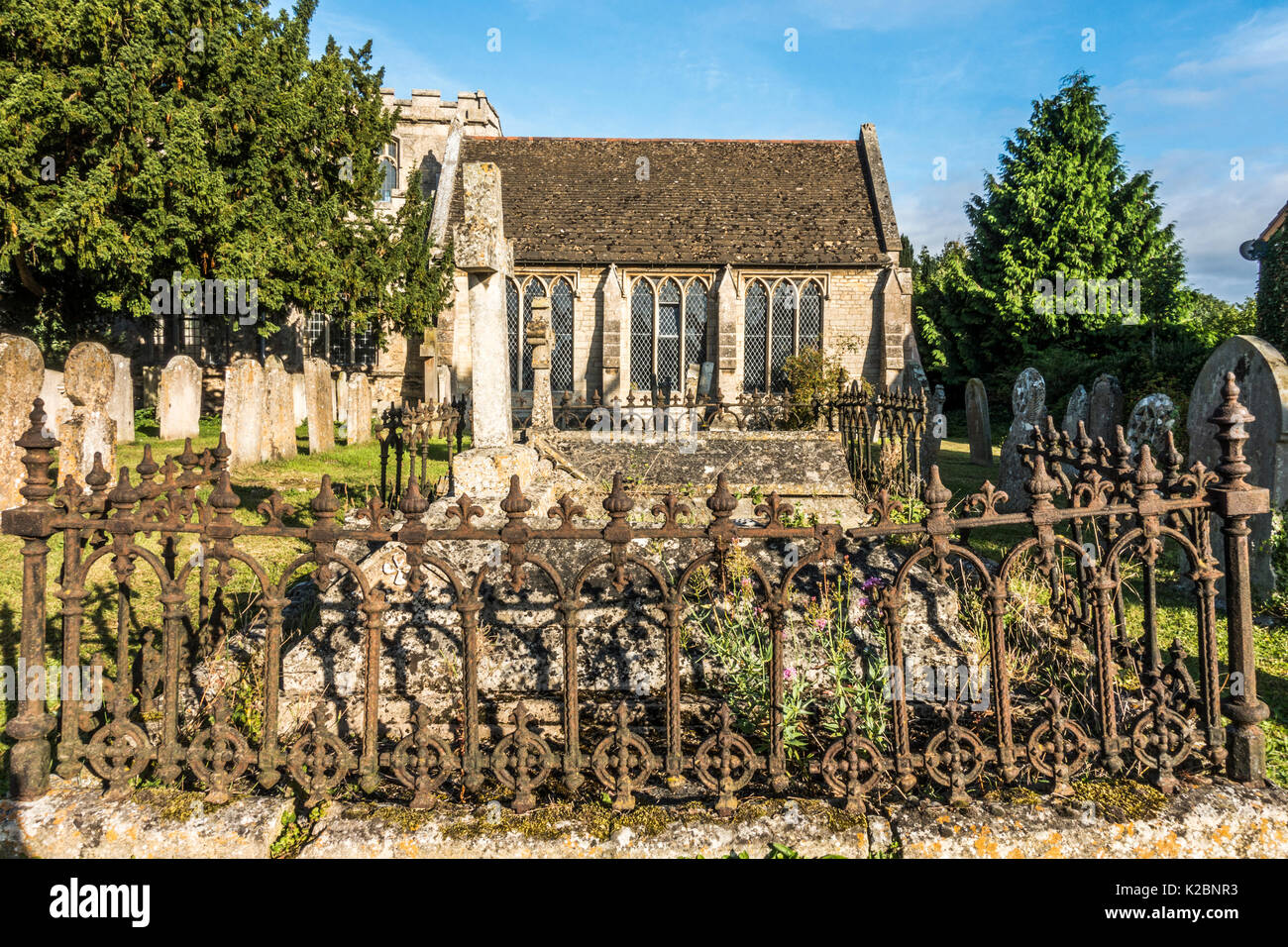 Ornate iron fencing around a number of old graves in the old church ...