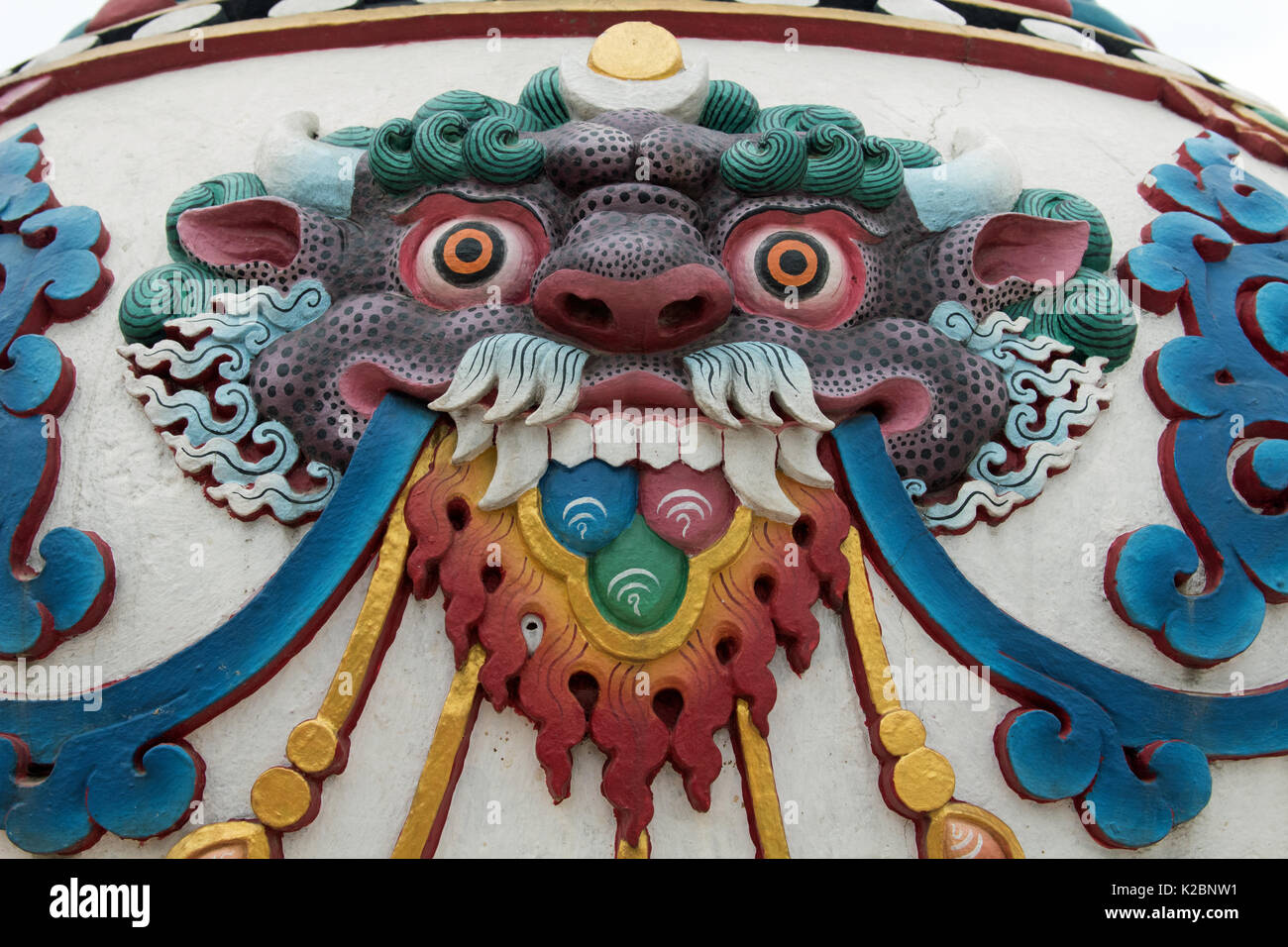 Multi-coloured lion carving at Boudha Stu[a Boudhanath Kathmandu Nepal ...