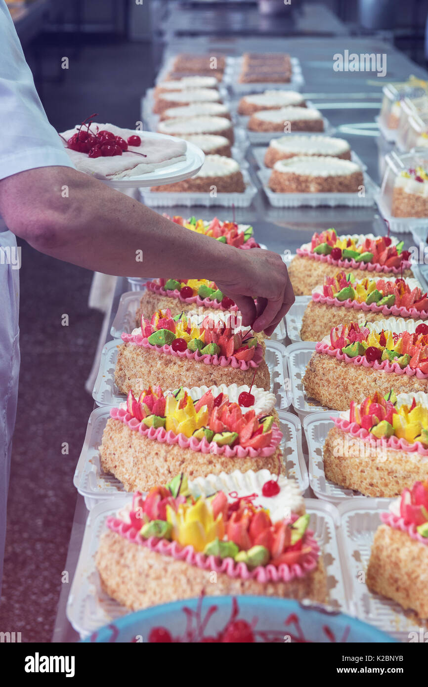 Manual cakes production on factory Stock Photo - Alamy