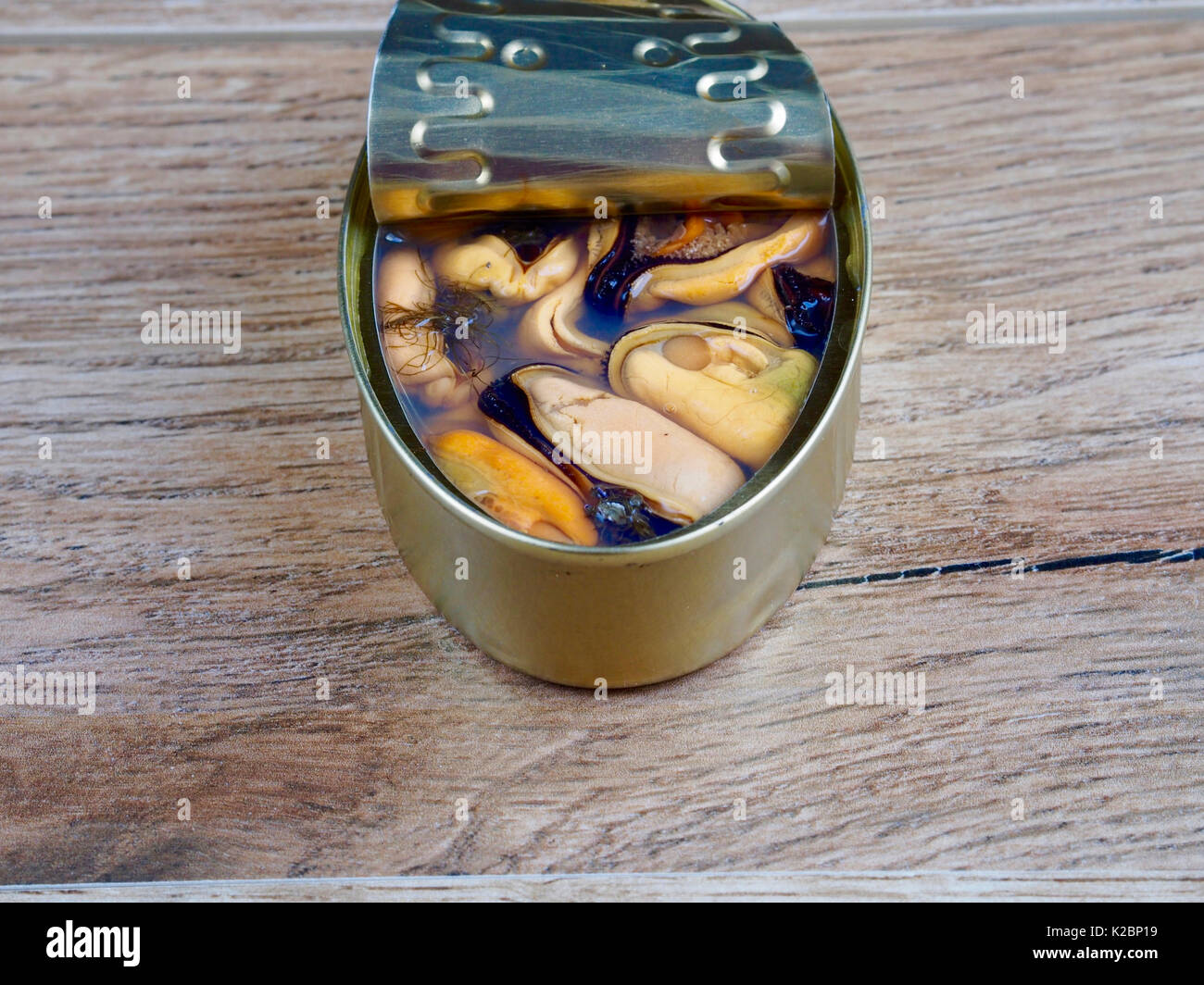 Natural mussels canned on wood background Stock Photo - Alamy