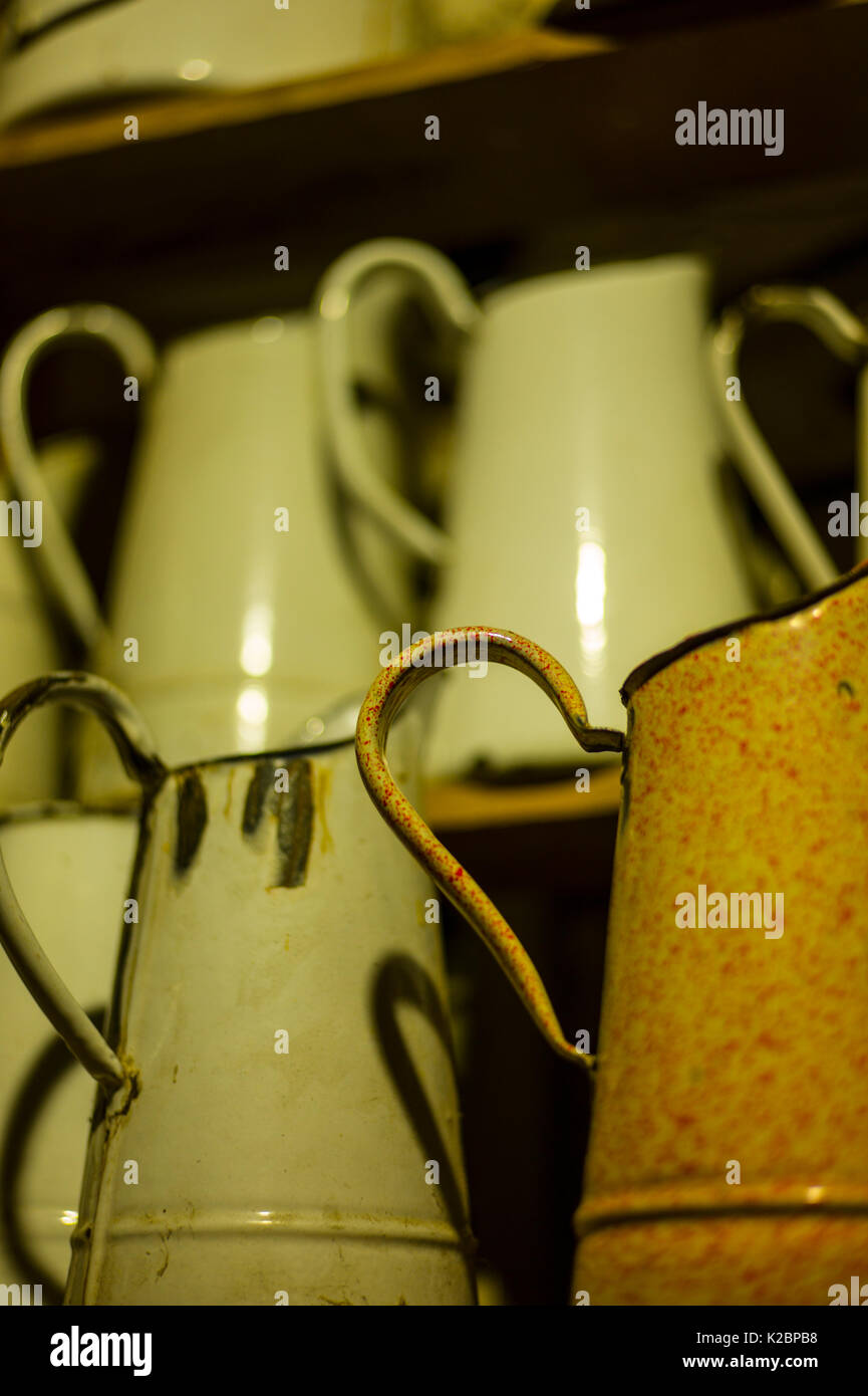 enamel jugs in a shop Stock Photo - Alamy