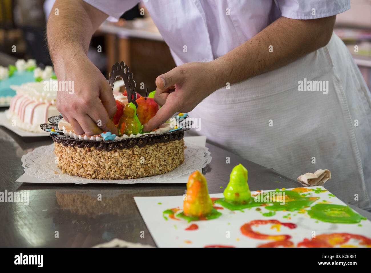 Manual cakes production Stock Photo - Alamy