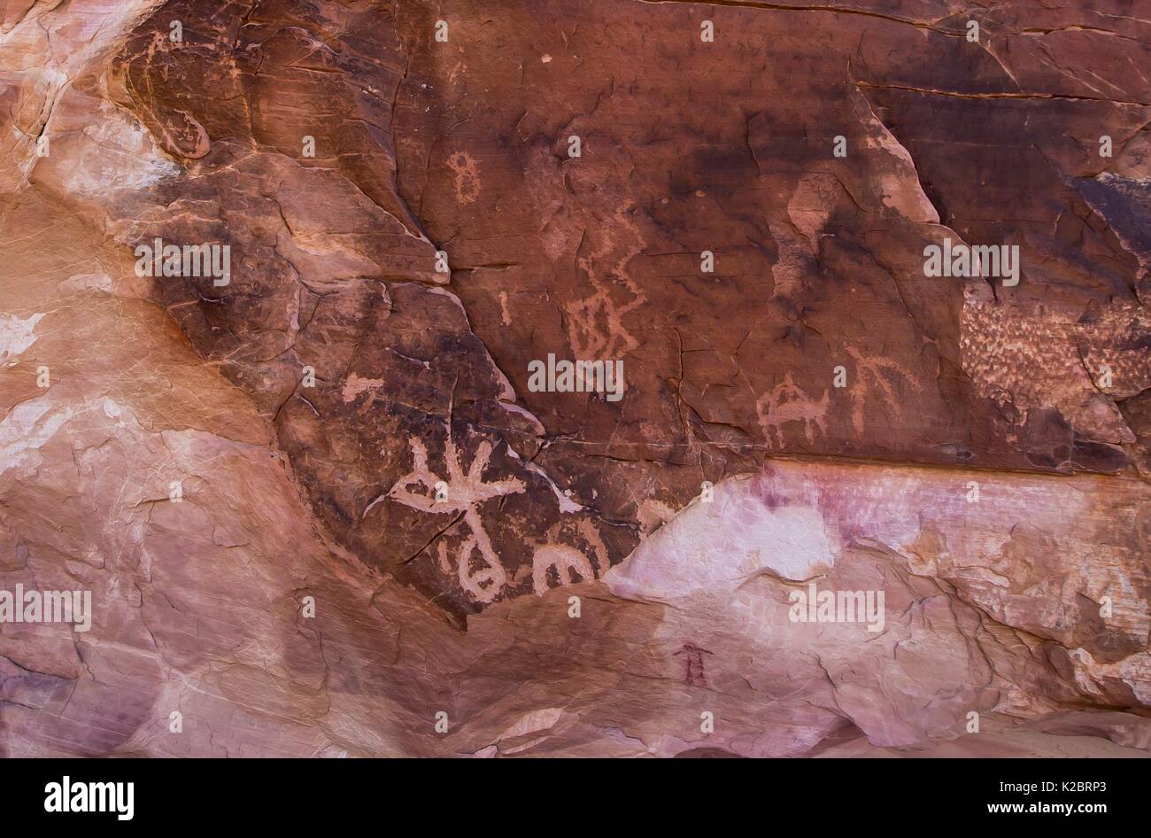Native American petroglyph rock art is carved into the Aztec sandstone ...