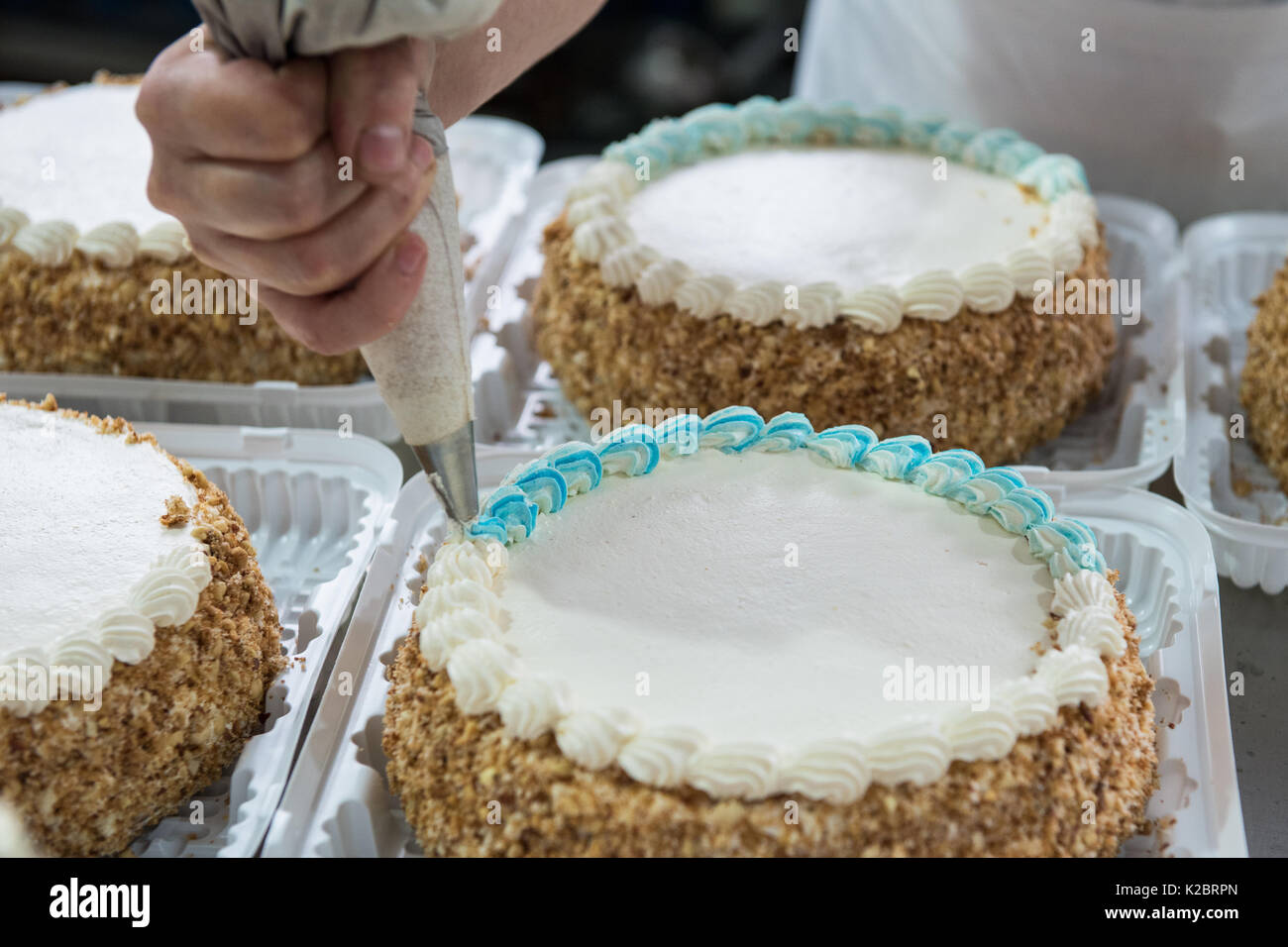 Manual cakes production Stock Photo - Alamy