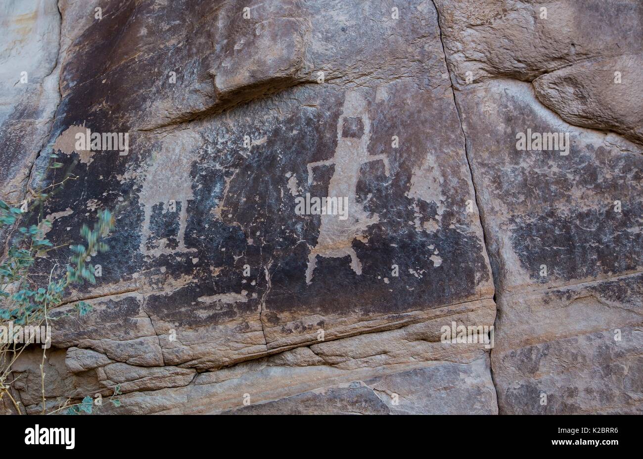 Native American petroglyph rock art is carved into the Aztec sandstone ...
