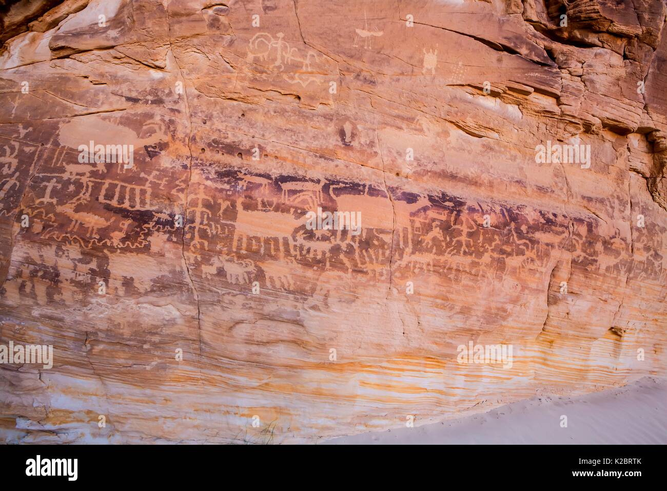 Native American petroglyph rock art is carved into the Aztec sandstone ...