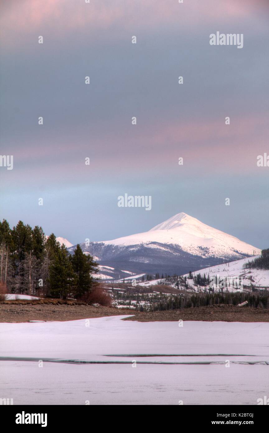 Sunset over Mount Quandaray with a frozen Lake Dillon in the foreground ...