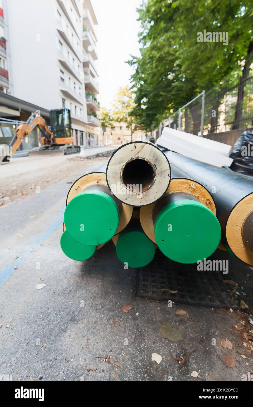 Road works in the city. Installation of steel tubes with thermal ...