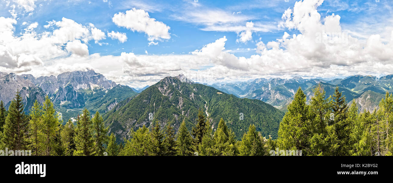 Beatifull mountain panorama with forest, blue sky and clouds. Italian ...