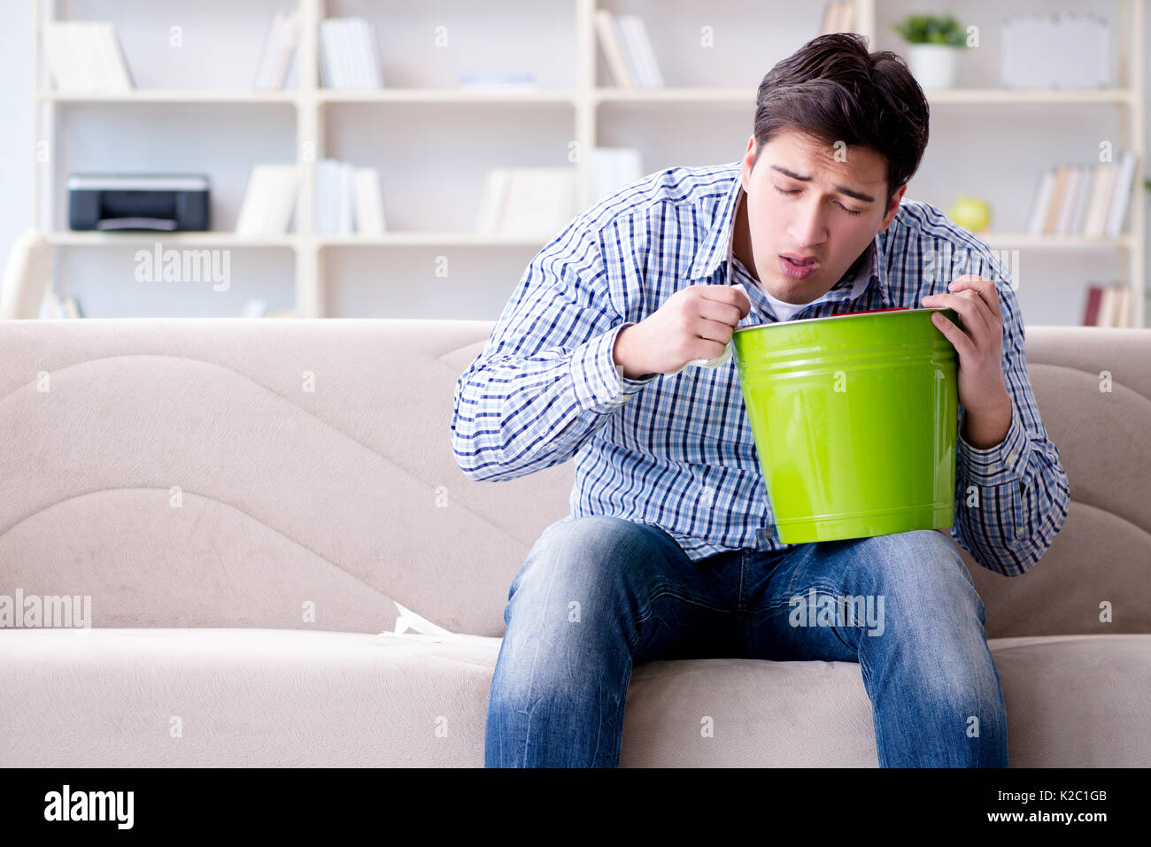 Man vomiting bucket hi-res stock photography and images - Alamy