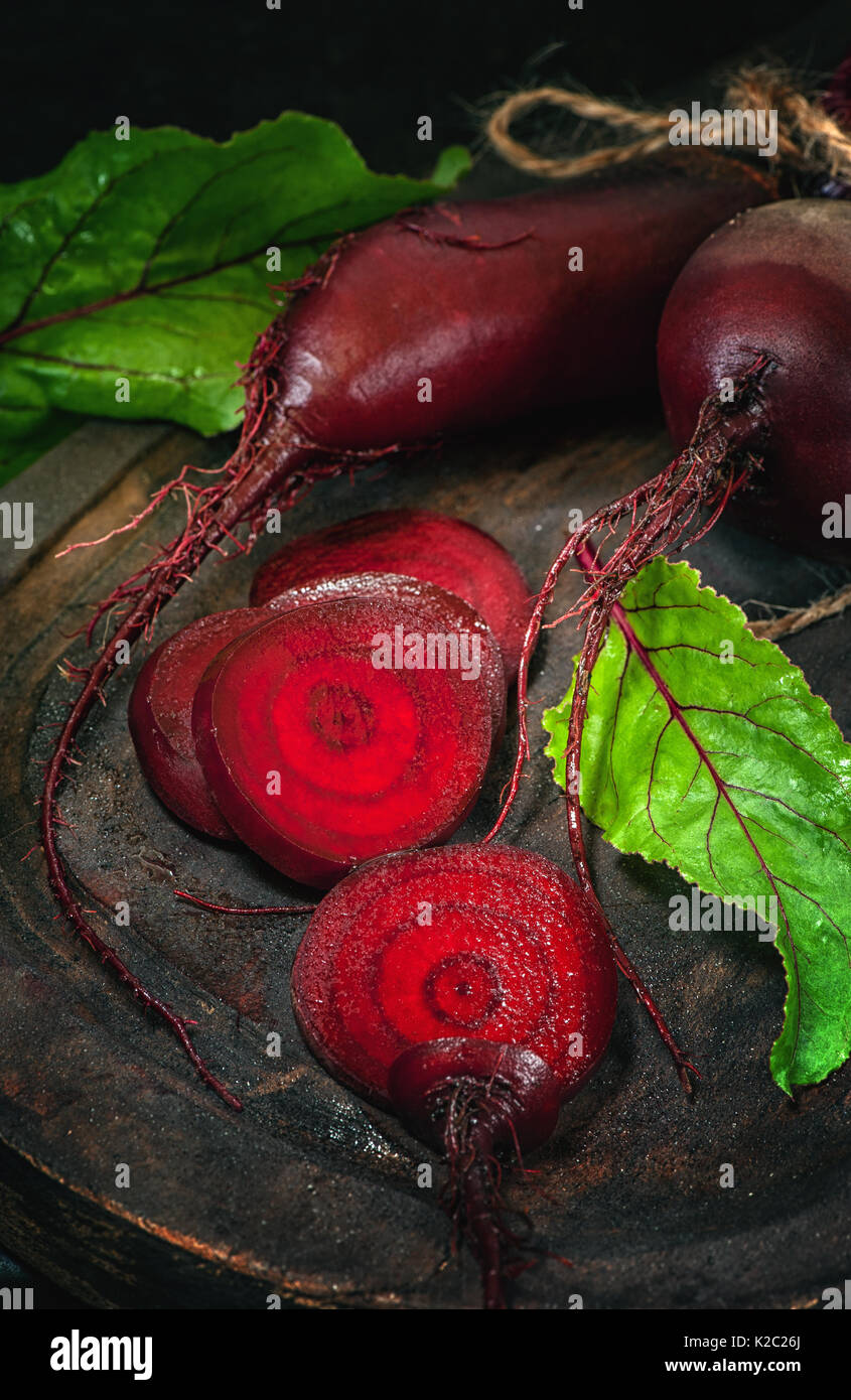 Sliced beets for making chips on a wooden Board in a rustic style Stock ...
