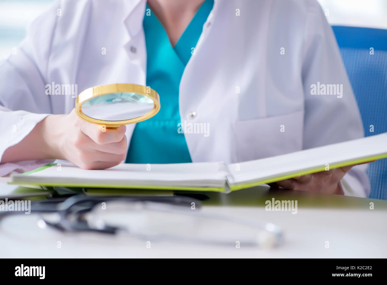 Doctor hand with magnifying glass Stock Photo - Alamy
