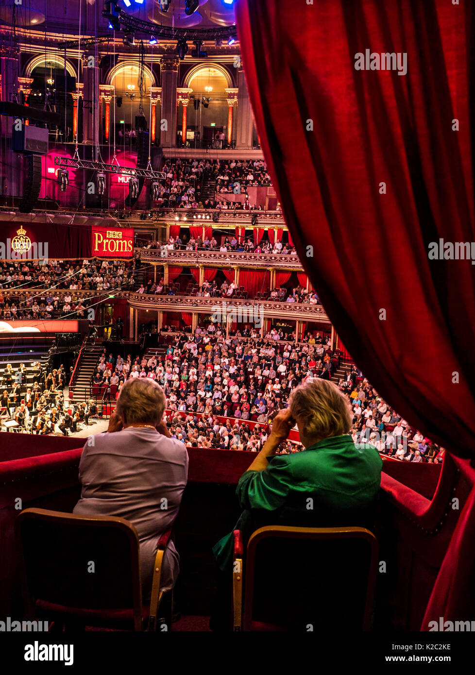 ALBERT HALL INTERIOR BBC PROMS Performance with ladies in foreground ...