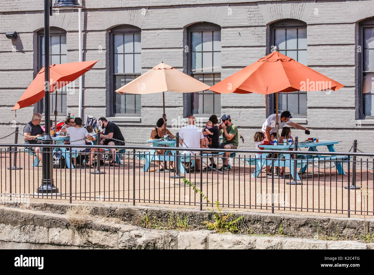 Families eating lunch at an outside restaurant, Canal Walk, Richmond ...
