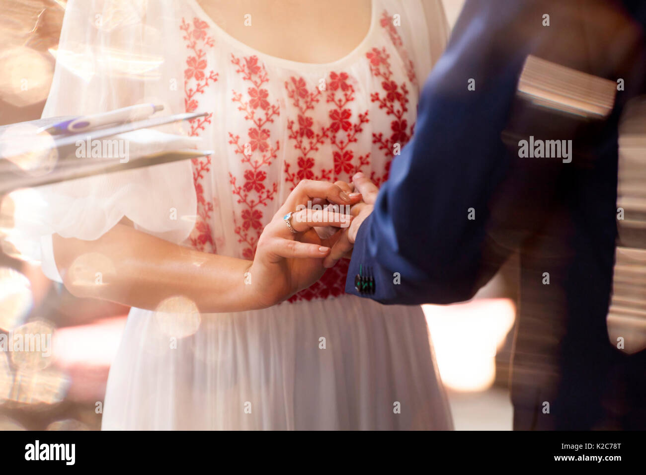 Bridegroom putting wedding ring on hi-res stock photography and images ...