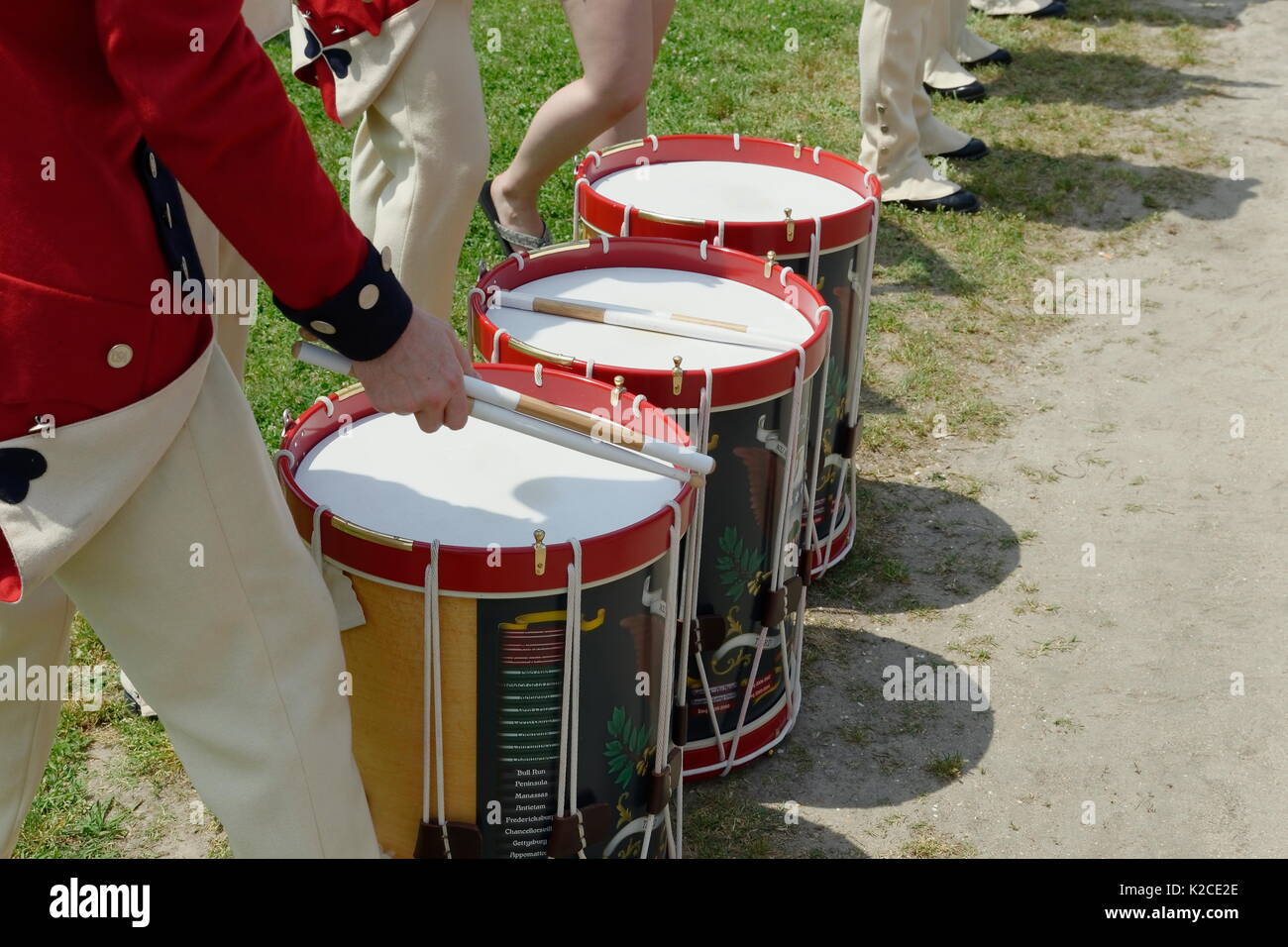 Three drums, two uniforms, and a female tourist.Colonial Williamsburg ...
