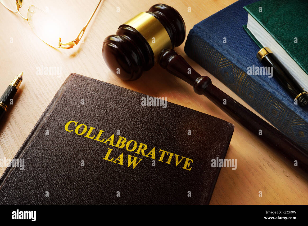 Collaborative law on a desk and gavel Stock Photo - Alamy