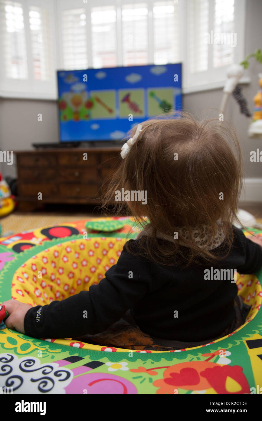 Baby watching tv hi-res stock photography and images - Alamy