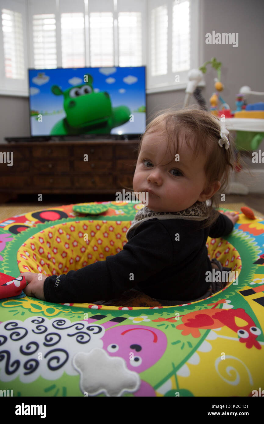 8 moth old baby watching TV Stock Photo - Alamy